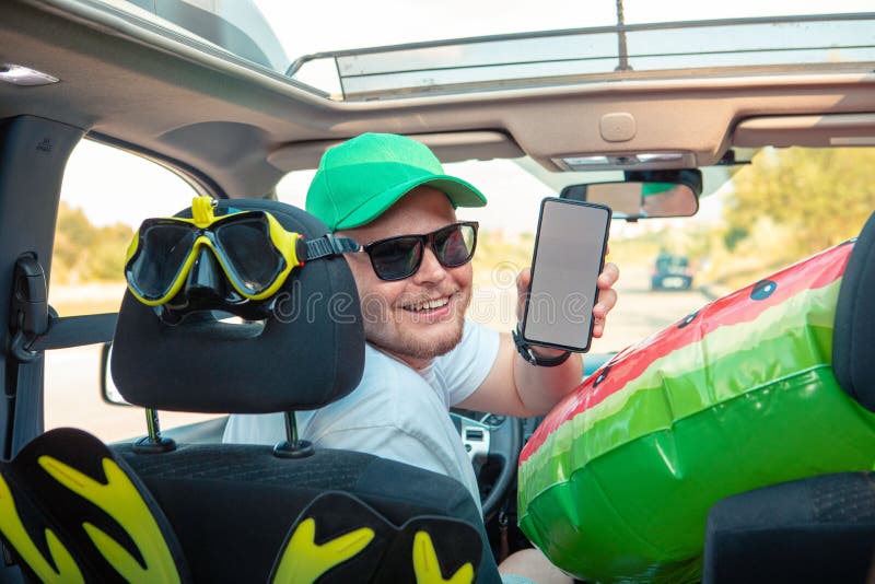Happy Driver Man Car Full of Vacation Stuff Holding Phone with White ...