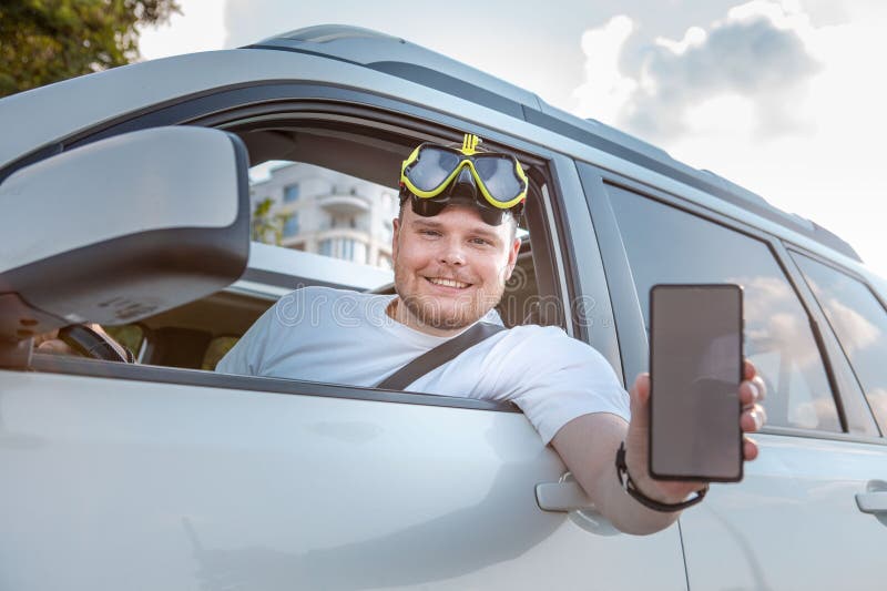 Happy Driver Man Car Full of Vacation Stuff Holding Phone with White ...