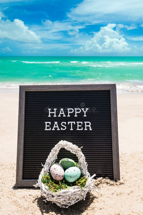 Happy Easter Beach Background with Black Board and Basket Stock Photo ...