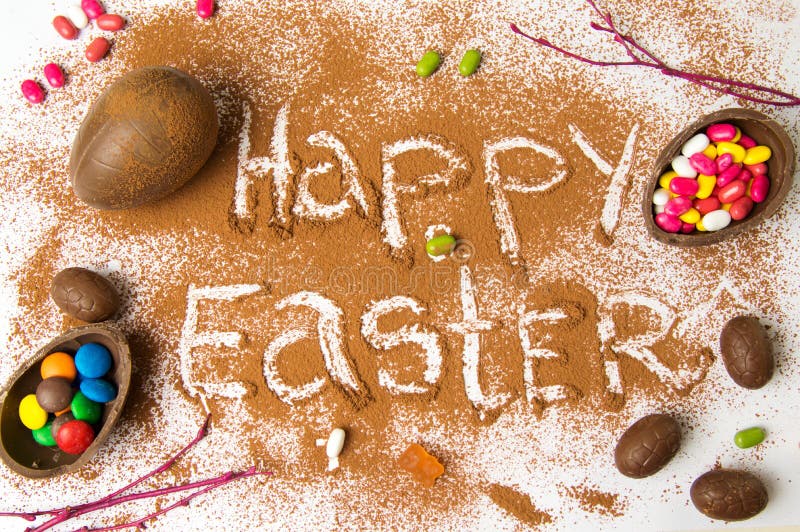 Happy Easter in Cacao Powder with Chocolate Eggs Stock Photo - Image of ...