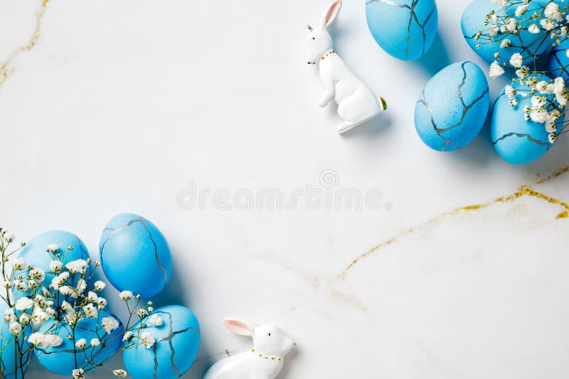 Happy Easter Concept. Blue Easter Eggs with Rabbits on Stone Table. Top ...