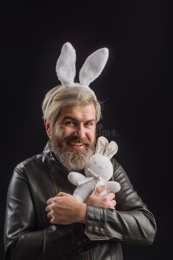 Happy Easter Day. Smiling Man in Bunny Ears with Plush Bunny Toy. Stock ...
