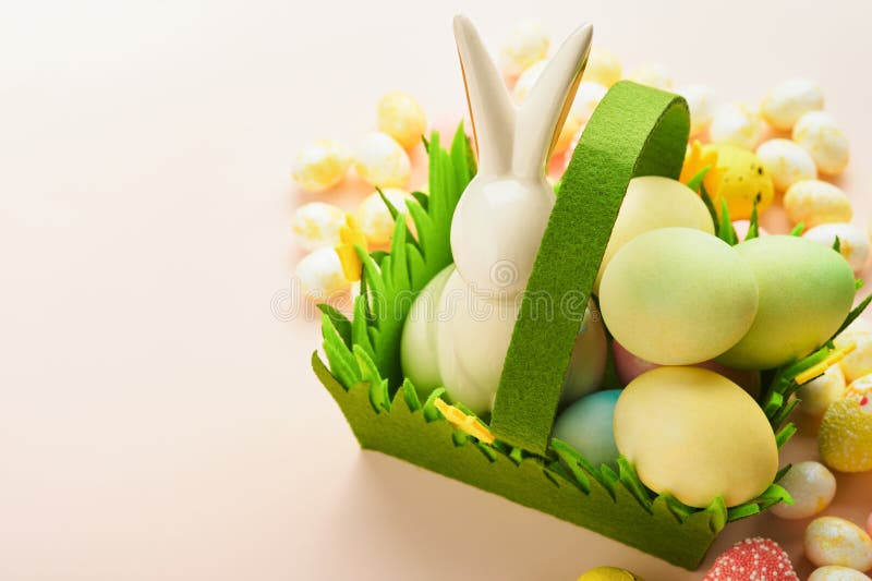 Happy Easter. Easter Eggs and Rabbit in Green Basket on Pink Background ...