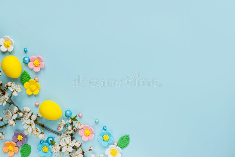 Happy Easter! Easter Eggs, Candy Flowers and Blooming Cherry Branch Flat Lay on Blue Background ...