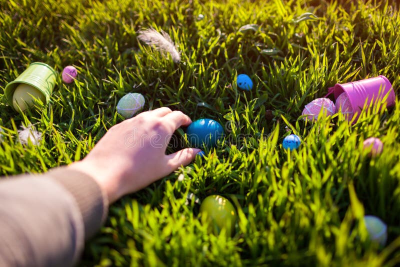 Happy Easter. Easter Eggs Hidden in Spring Grass. Woman Holding Egg ...
