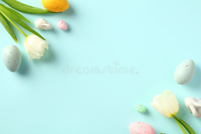 Happy Easter Flat Lay Composition. Frame of Easter Eggs with Tulips on Pastel Blue Background ...