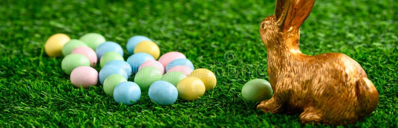Happy Easter, Gold Easter Bunny and Pastel Colored Candy Coated Easter ...