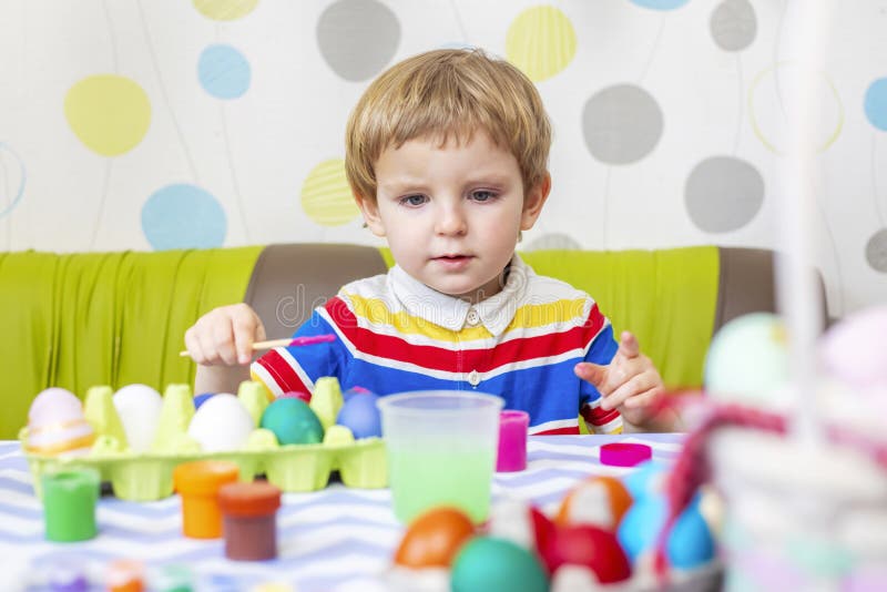 Happy Easter. Boy Dyes Colorful Egg for Easter Hunt Stock Photo - Image ...