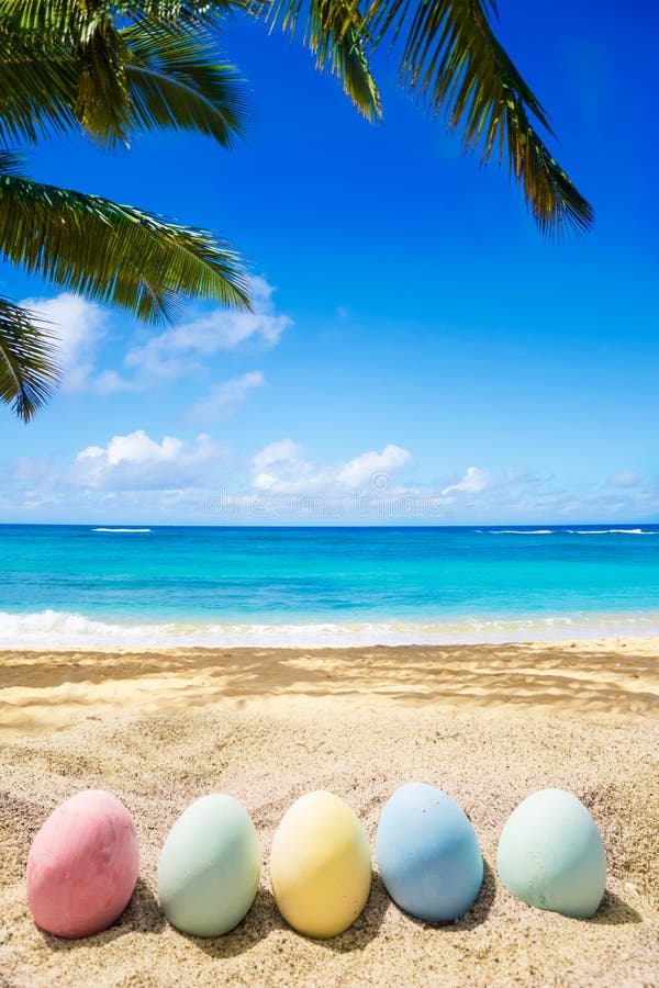 Easter eggs on the beach stock photo. Image of umbrella - 90451756