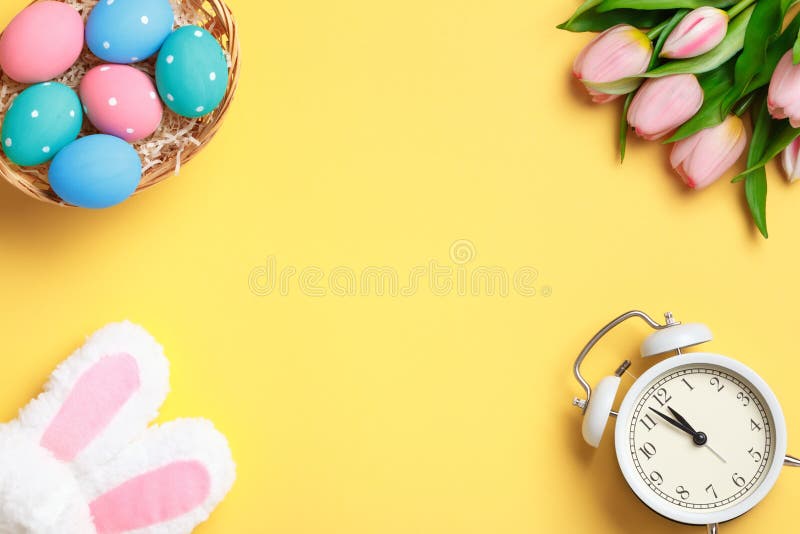 Happy Easter. Multicolored Eggs, Tulips and an Alarm Clock on a Yellow ...
