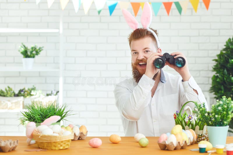 Happy Easter. a Smiling Bearded Fat Man Looks through Binoculars at a ...