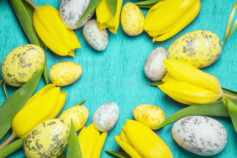 Happy Easter. Yellow Fresh Tulips Lie on a Blue Background with Easter ...