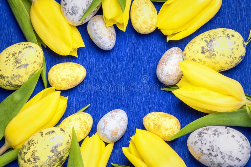 Happy Easter. Yellow Fresh Tulips Lie on a Blue Background with Easter ...