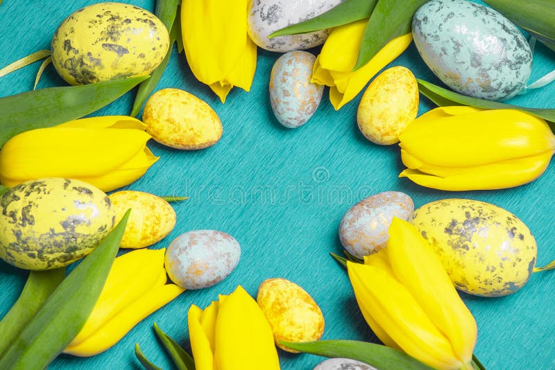 Happy Easter. Yellow Fresh Tulips Lie on a Blue Background with Easter ...