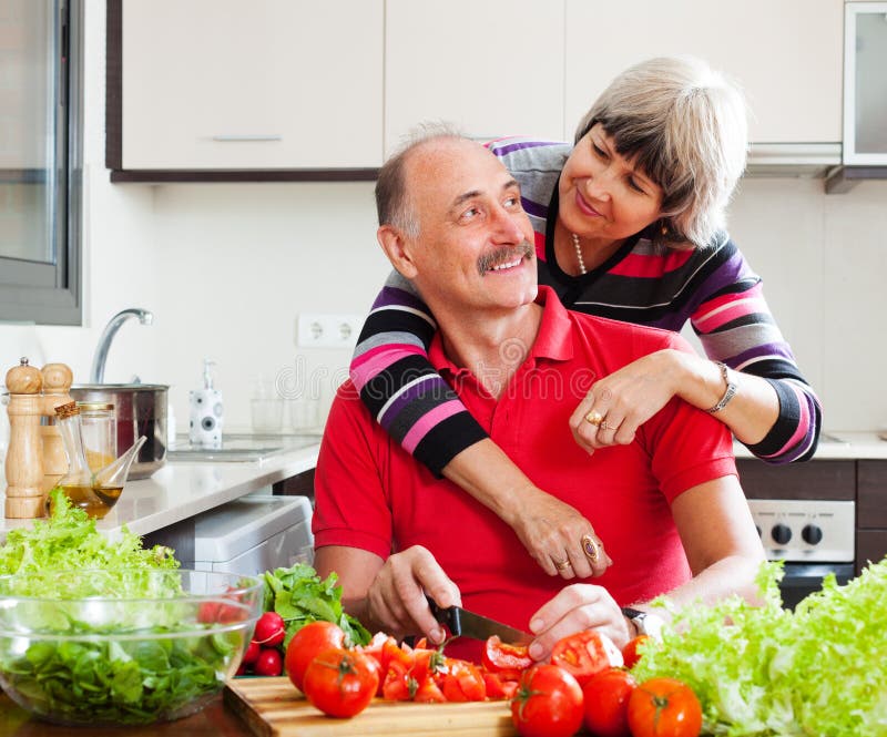 Happy Elderly Couple Cooking in Home Kitchen Stock Image - Image of ...