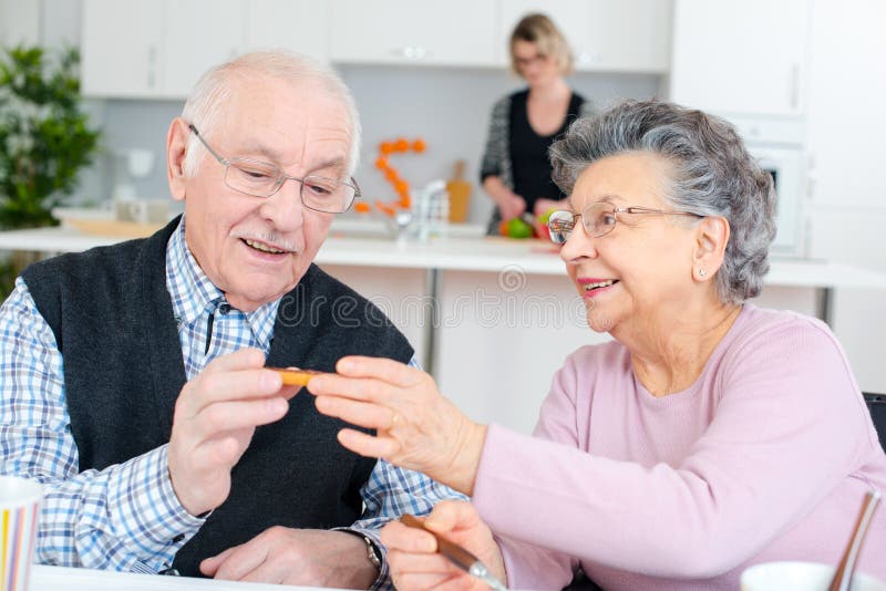 Happy Elderly Couple Eating Dinner Stock Photo - Image of eating ...