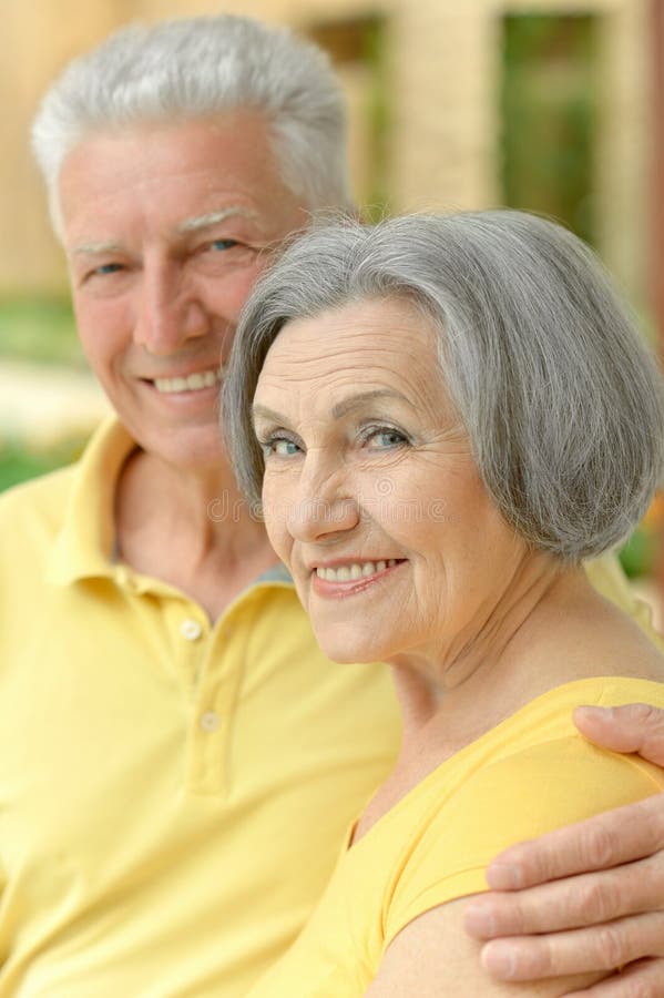Happy Elderly Couple Embracing Stock Photo - Image of embrace ...