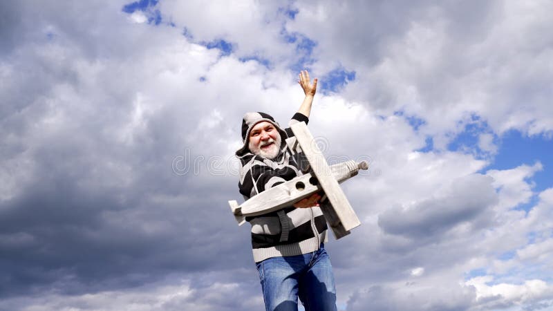 Happy Elderly Man Imagine Flying on Model Aircraft in Sky, Plane ...