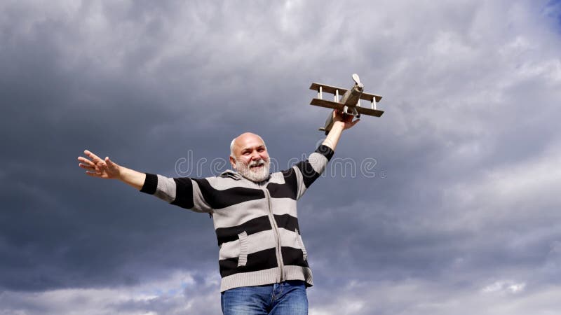 Happy Old Man Pretend Flying on Model Aircraft in Sky, Pretending Stock ...
