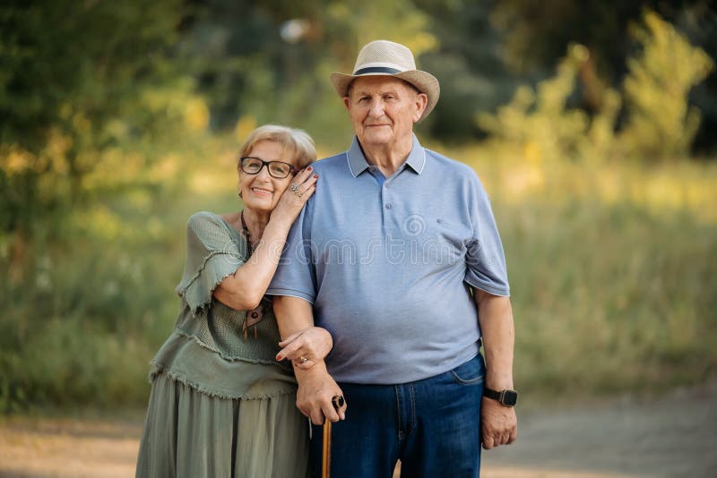 Happy Elderly People Walking in the Park on a Sunny Day Stock Photo ...