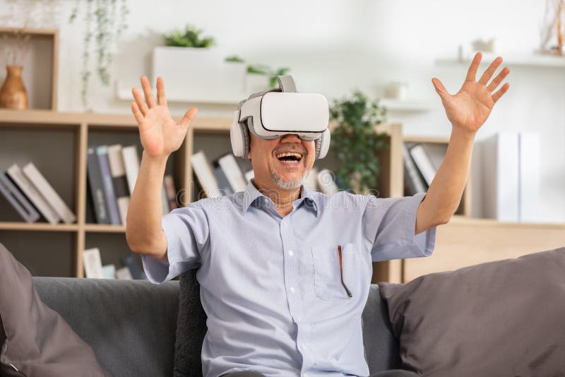 Happy Elderly Using VR or Virtual Reality Glasses Headset Pointing ...