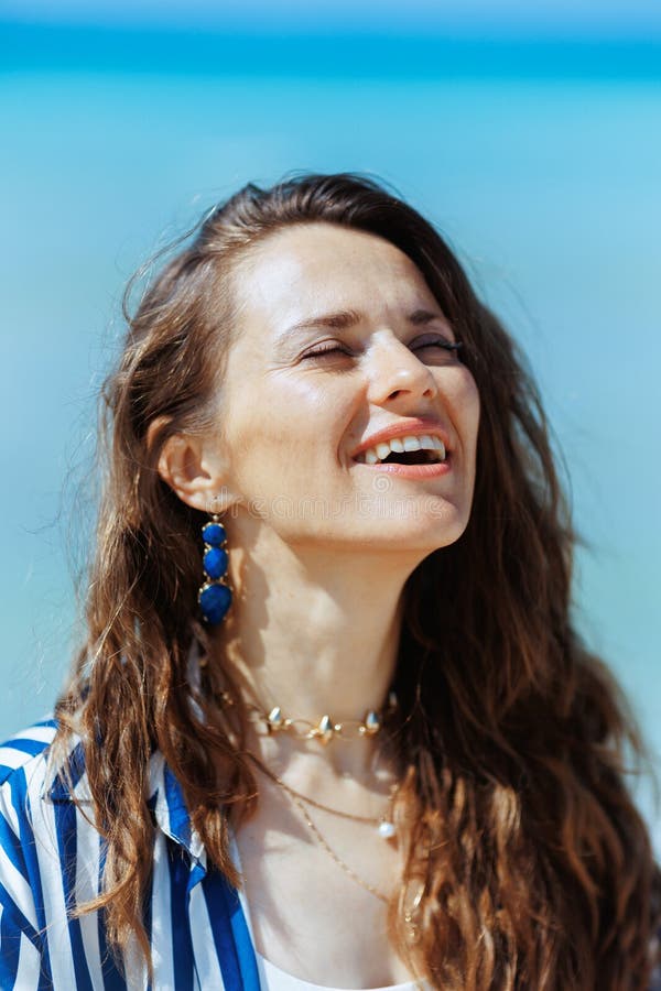 Happy Elegant Woman on Seacoast Enjoying Tranquility Stock Image ...
