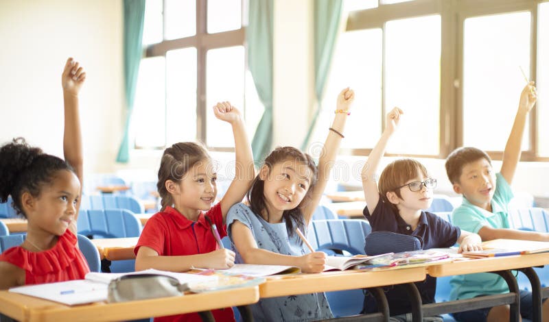 Elementary School Kids in Classroom Stock Photo - Image of group, faces ...