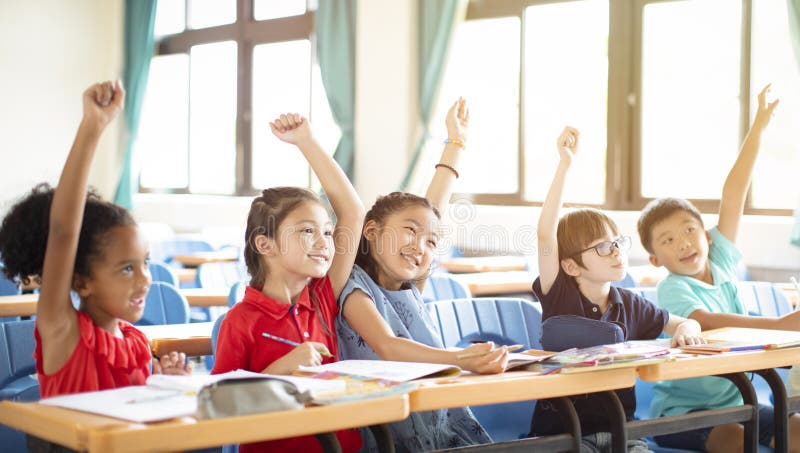 Elementary School Kids in Classroom Stock Image - Image of group, desk ...