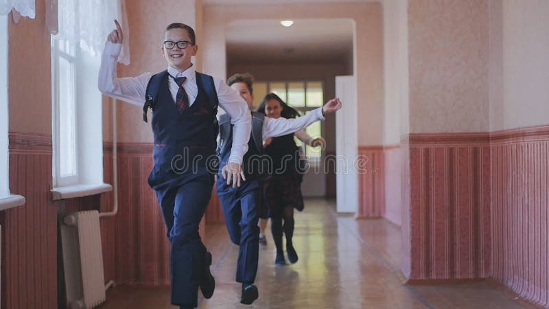 Happy Students Run Out of the Classroom and Run Down the Hall Stock ...