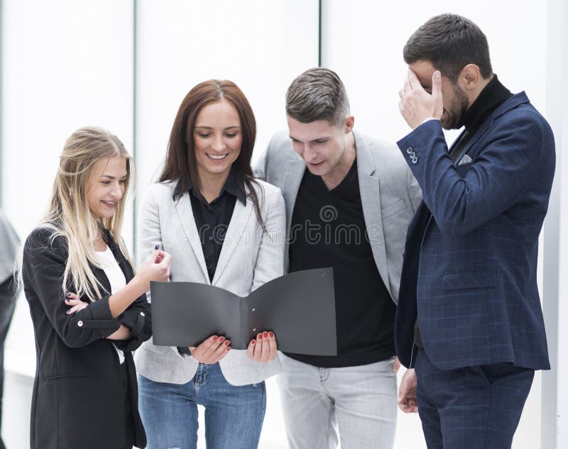 Happy Employees Reading a Business Document Together Stock Photo ...