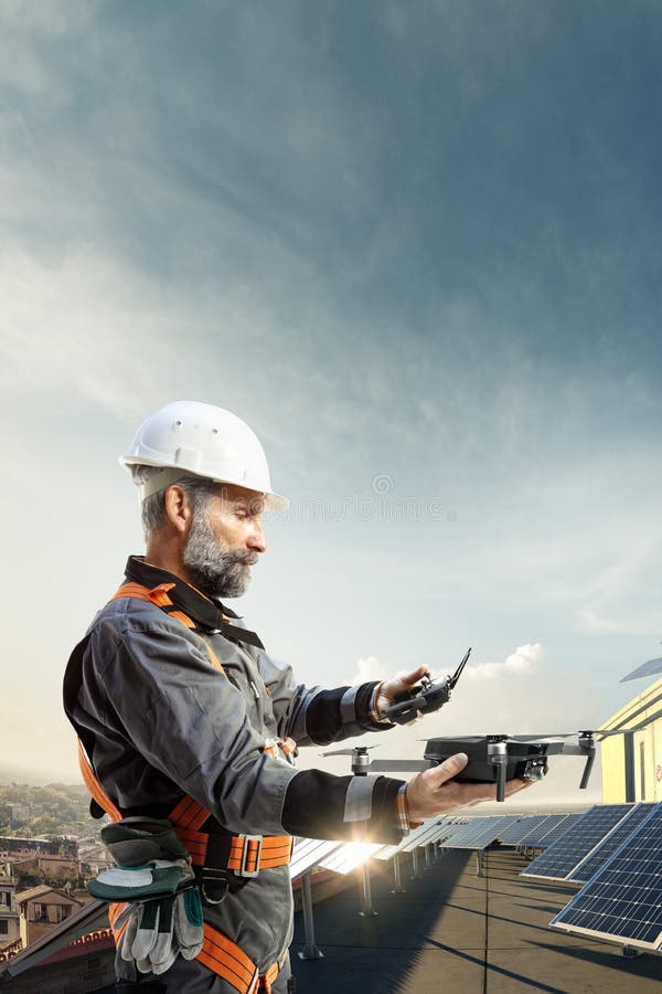 Happy Engineer Using Drone for Cheking Solar Station. in Roof Stock ...