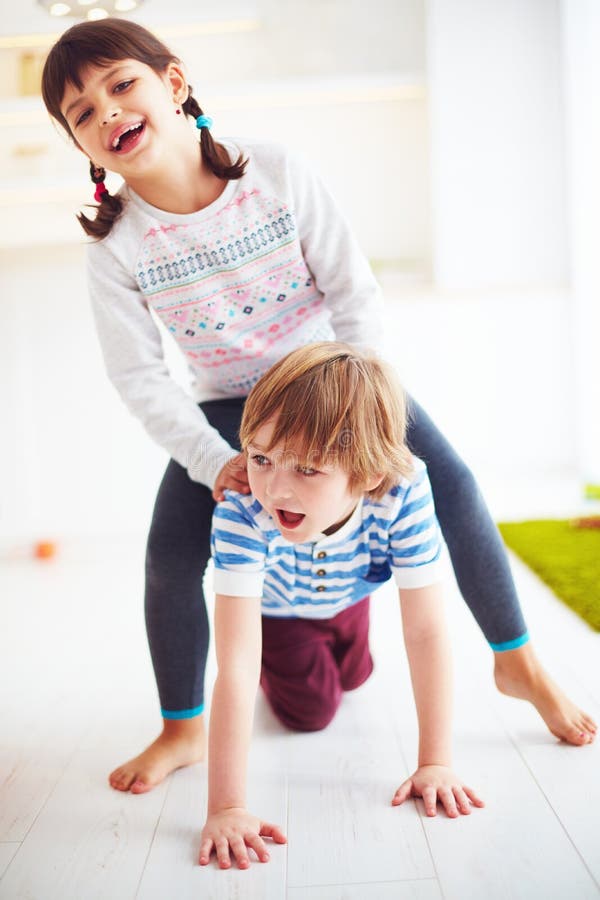 Happy Excited Kids Having Fun , Riding on the Back at Home Stock Photo ...