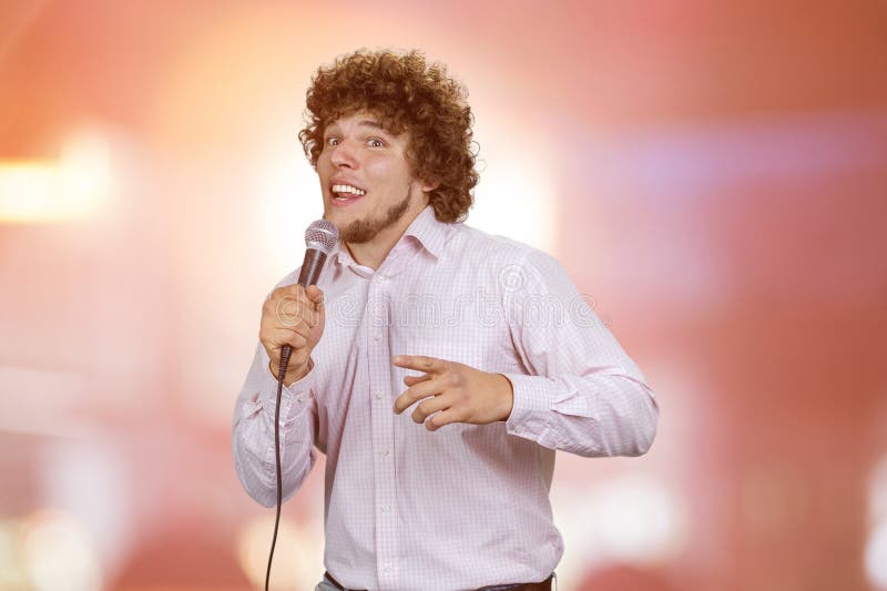 Happy Excited Young Man with Curly Hair Singing in Microphone. Stock ... Happy Excited Young Man with Curly Hair Singing in Microphone. Stock ...