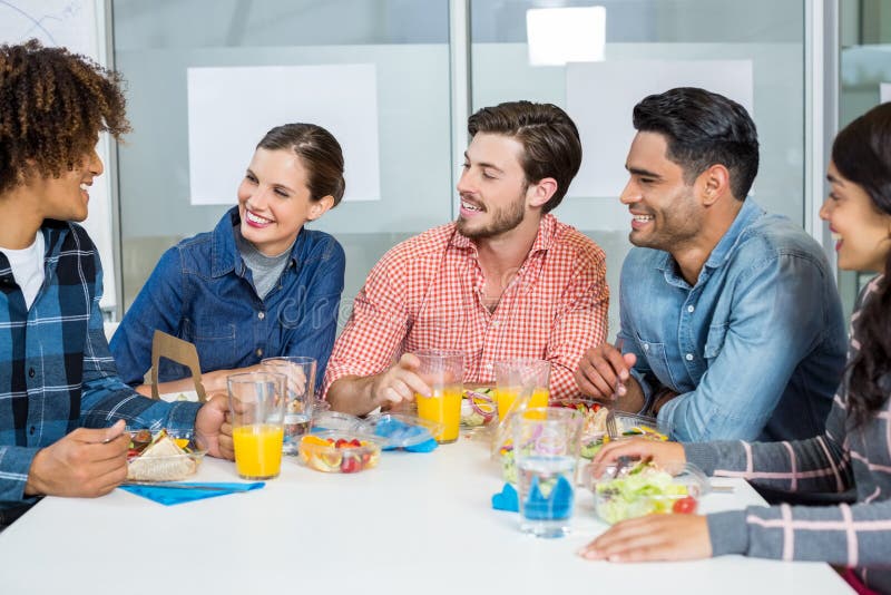 Happy Executives Interacting while Having Breakfast Stock Image - Image ...