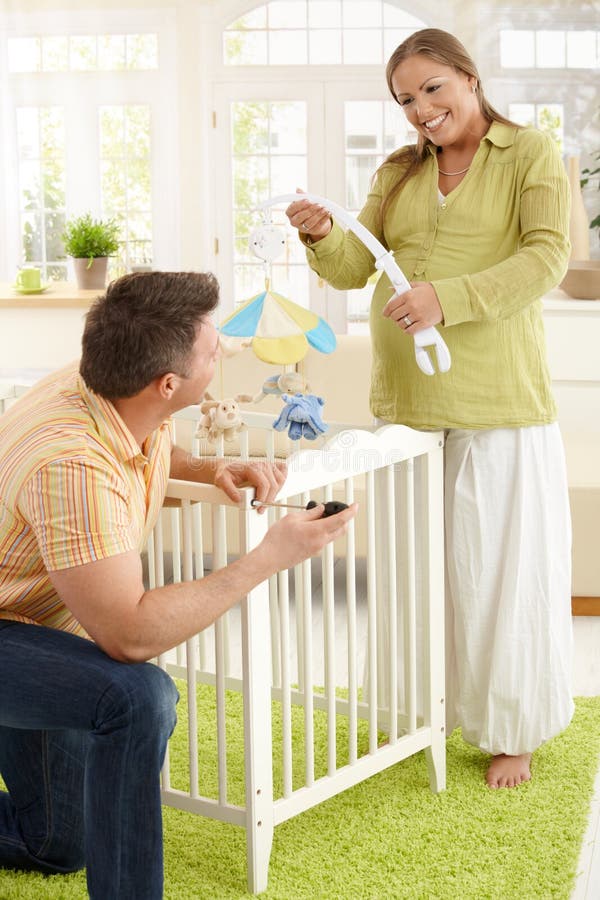 Happy Expecting Couple in Baby S Room Stock Photo - Image of brunette ...