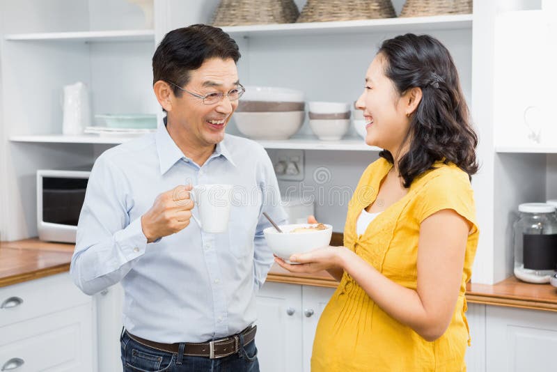 Happy Expectant Couple in the Kitchen Stock Photo - Image of cereals ...