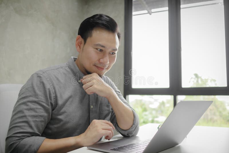 Happy Face of Man Working on Laptop Alone in the Room. Stock Image ...