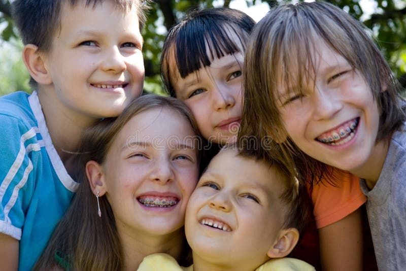 Happy faces of children stock image. Image of light, kids - 1068915