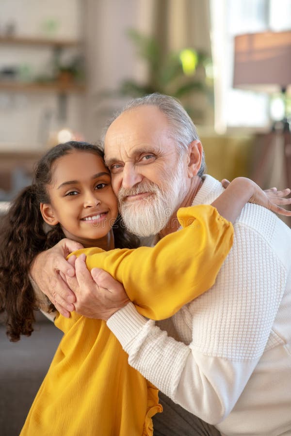 Grey-haired Man and a Dark-skinned Girl Looking Joyful Stock Image ...