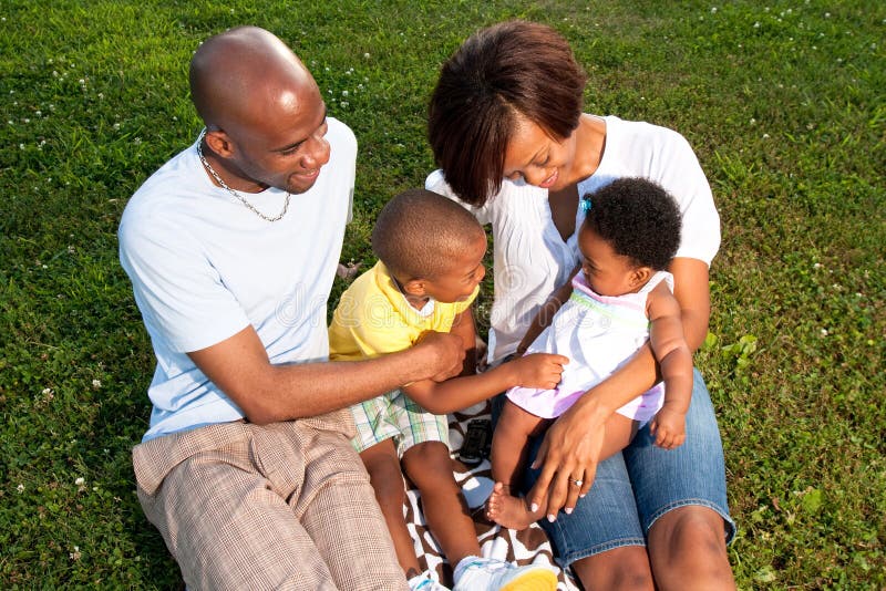 Bi-racial Family Picnic stock photo. Image of father, affection - 1524720