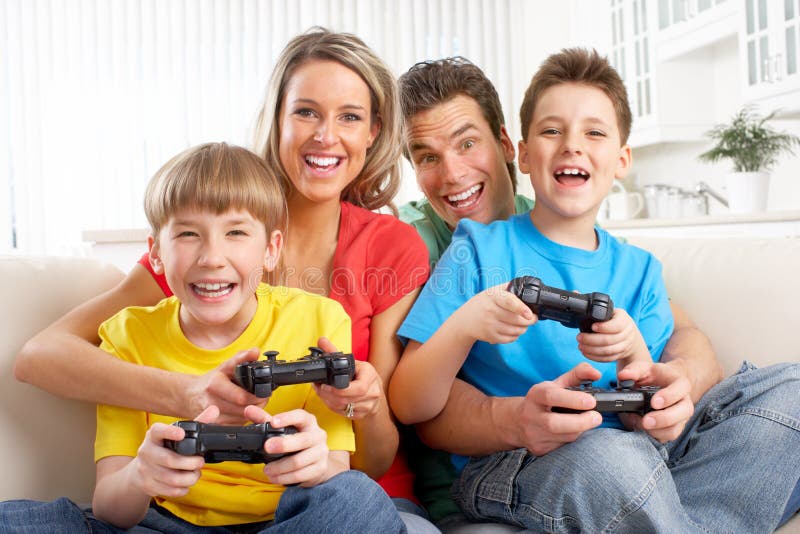 Children Playing Video Games and Family on Sofa Stock Photo - Image of ...