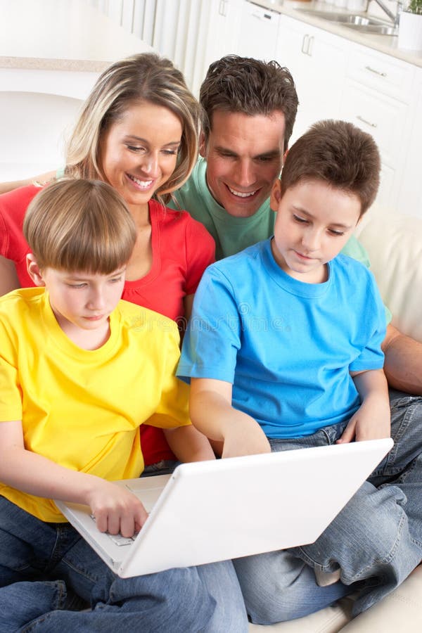 Family Group Using Computer Together Stock Photo - Image of sister ...
