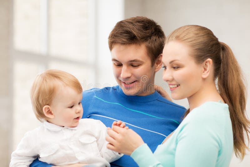 Happy Family with Adorable Baby Stock Photo - Image of holding ...