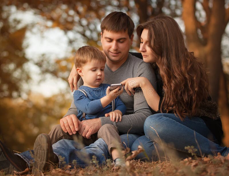 Happy Family in Autumn Forest Stock Photo - Image of park, happy: 60401574