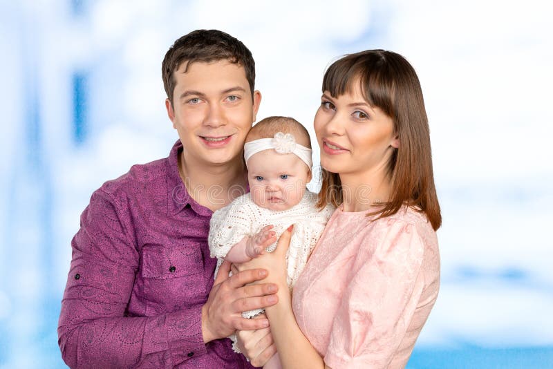 Young man holding a baby stock photo. Image of family - 69704154