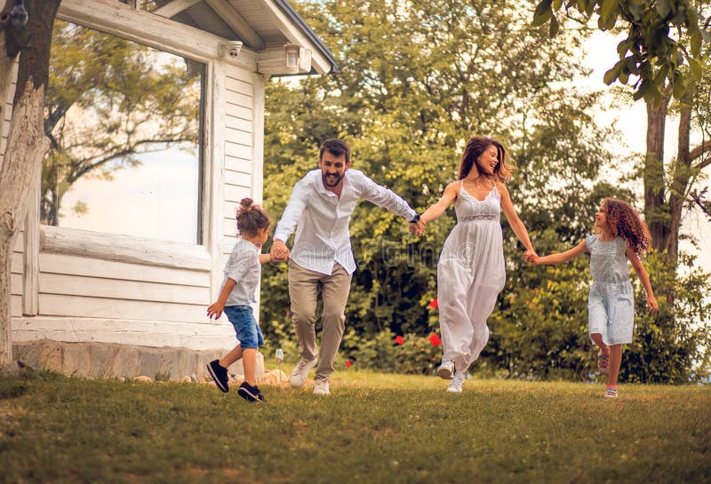 Happy family in backyard stock photo. Image of ethnicity - 217957678