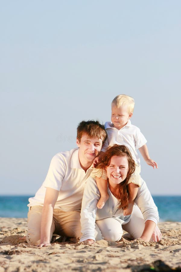 Happy family on beach stock image. Image of child, fatherhood - 11441235