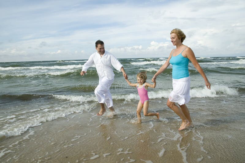 Happy family on the beach stock image. Image of father - 6332751