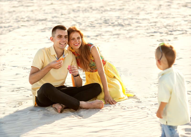 Happy family on the beach stock image. Image of happy - 44985143