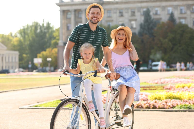 Happy Family with Bicycle Outdoors Stock Image - Image of male ...